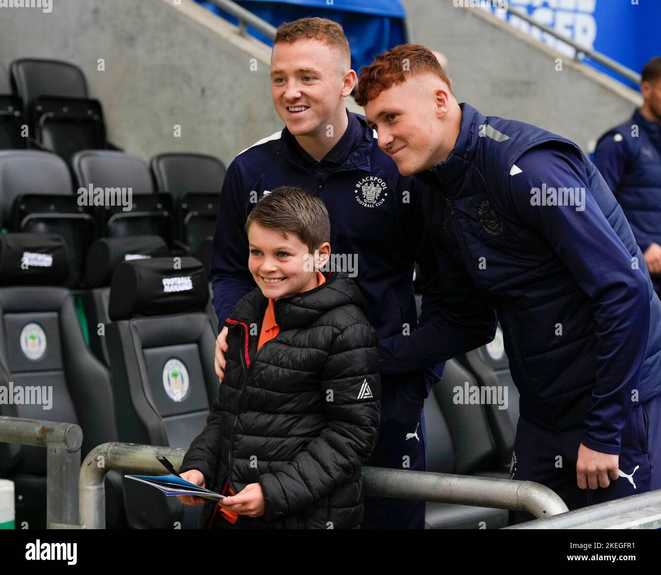 Shayne Lavery #19 and Sonny Carey of Blackpool pose for a photo with a ...
