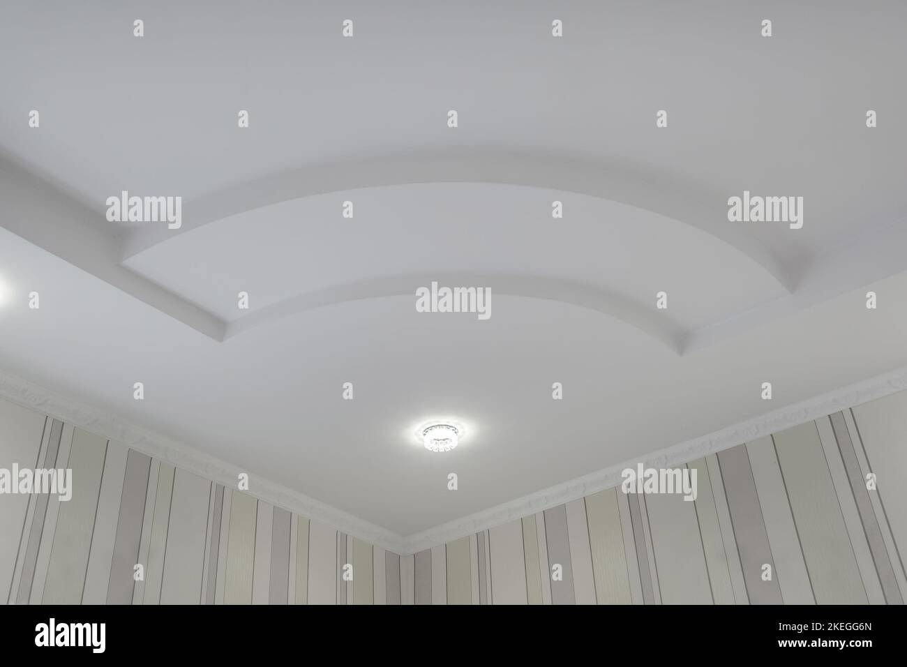 Detail of corner ceiling with intricate crown molding. Suspended ...