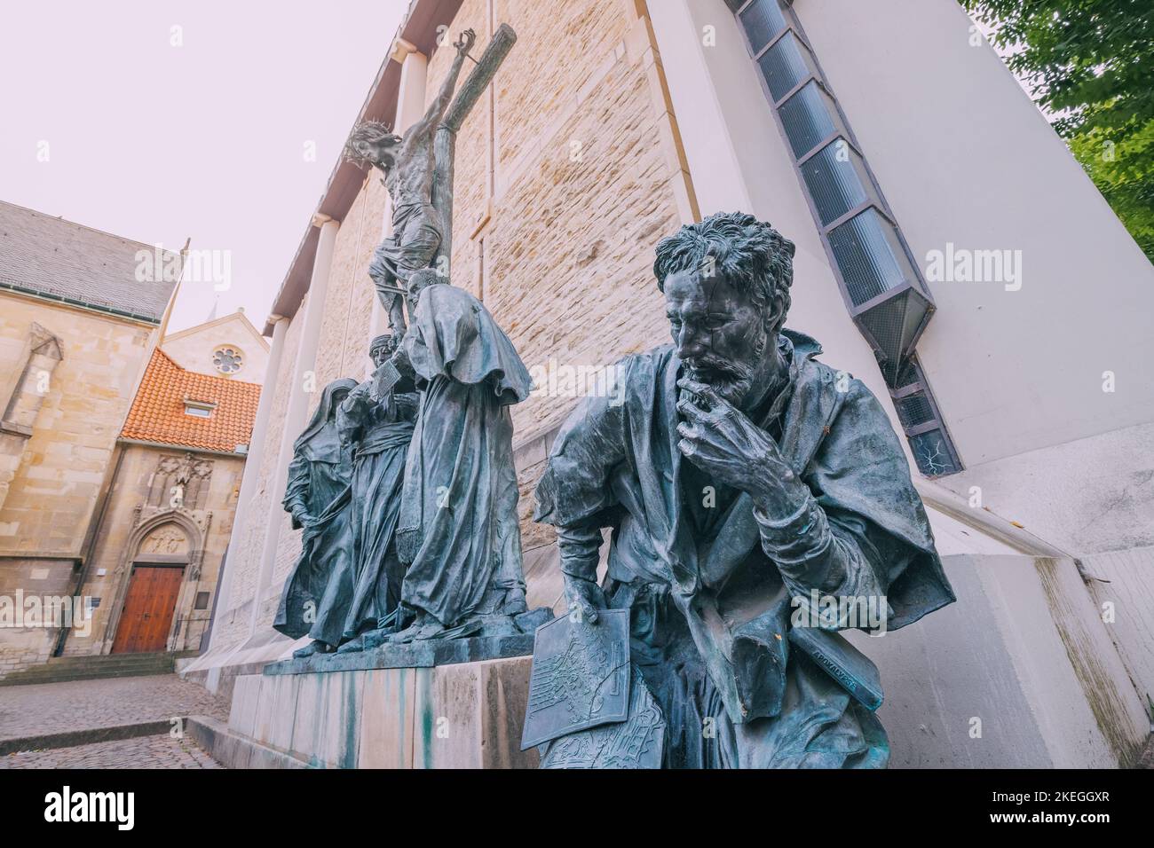 25 July 2022, Munster, Germany: Old medieval statue of a nun and family ...