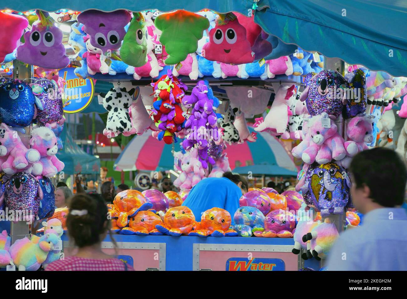 A game booth with various bright and inviting prizes at the 2022 ...