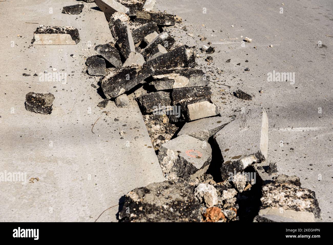 Asphalt road under repairs, lifting the old and broken black asphalt ...
