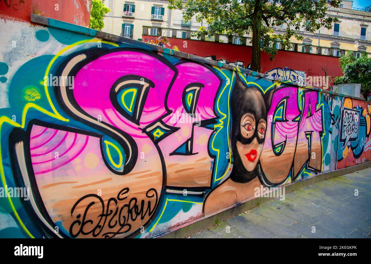 April 15 2022 Naples graffiti on a wall in Naples with pink and black ...