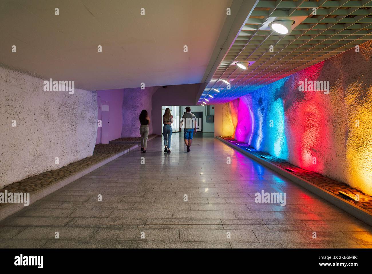 Bright beautiful underpass with colorful illumination in center of city ...