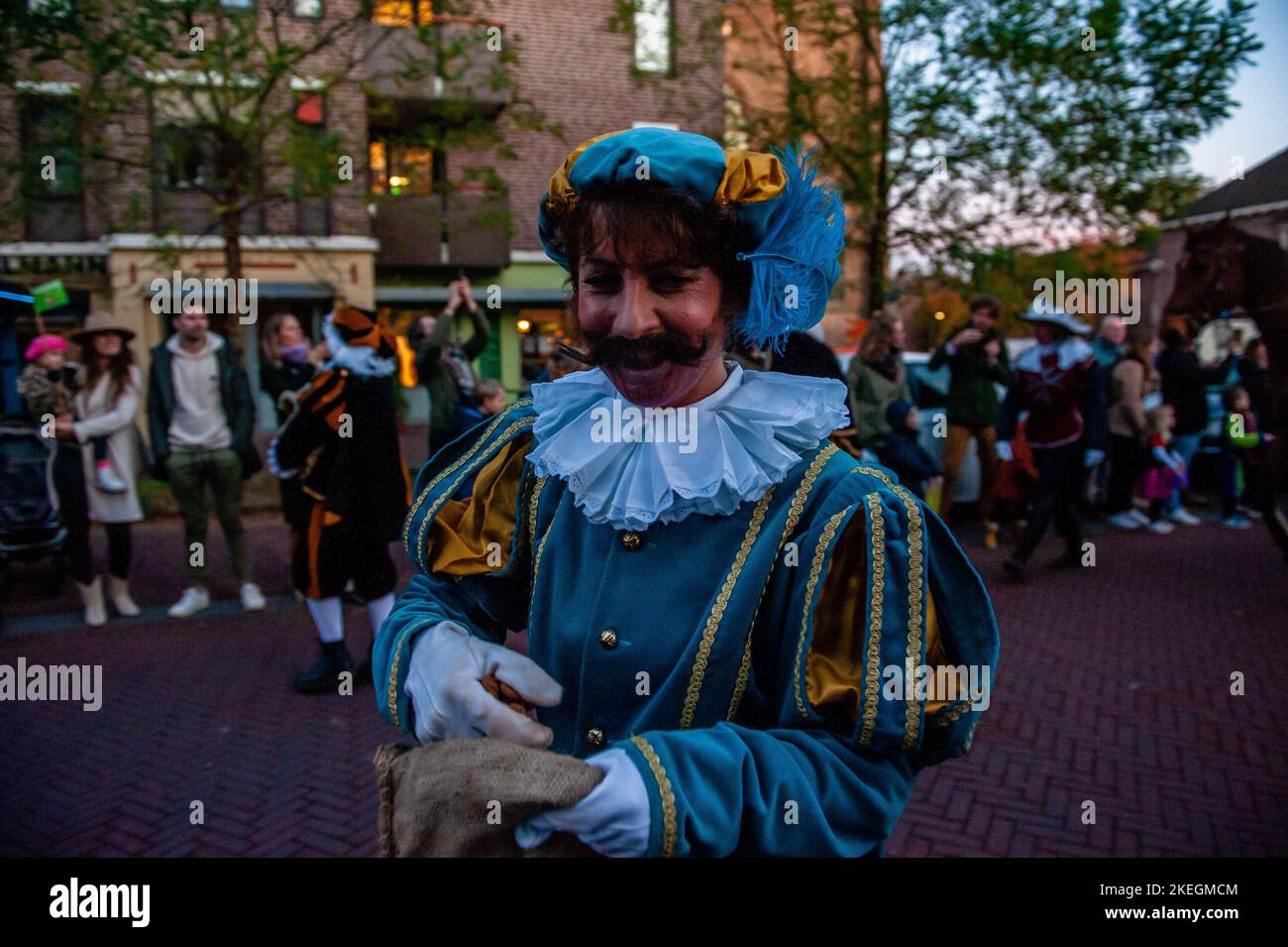A female St Nicholas' helper is seen wearing a fake mustache. The first ...