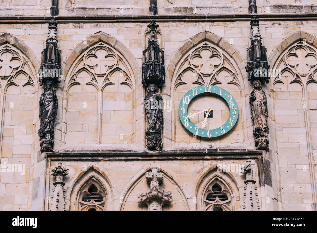 Clock tower on the spire of a rathaus of old european city Stock Photo ...
