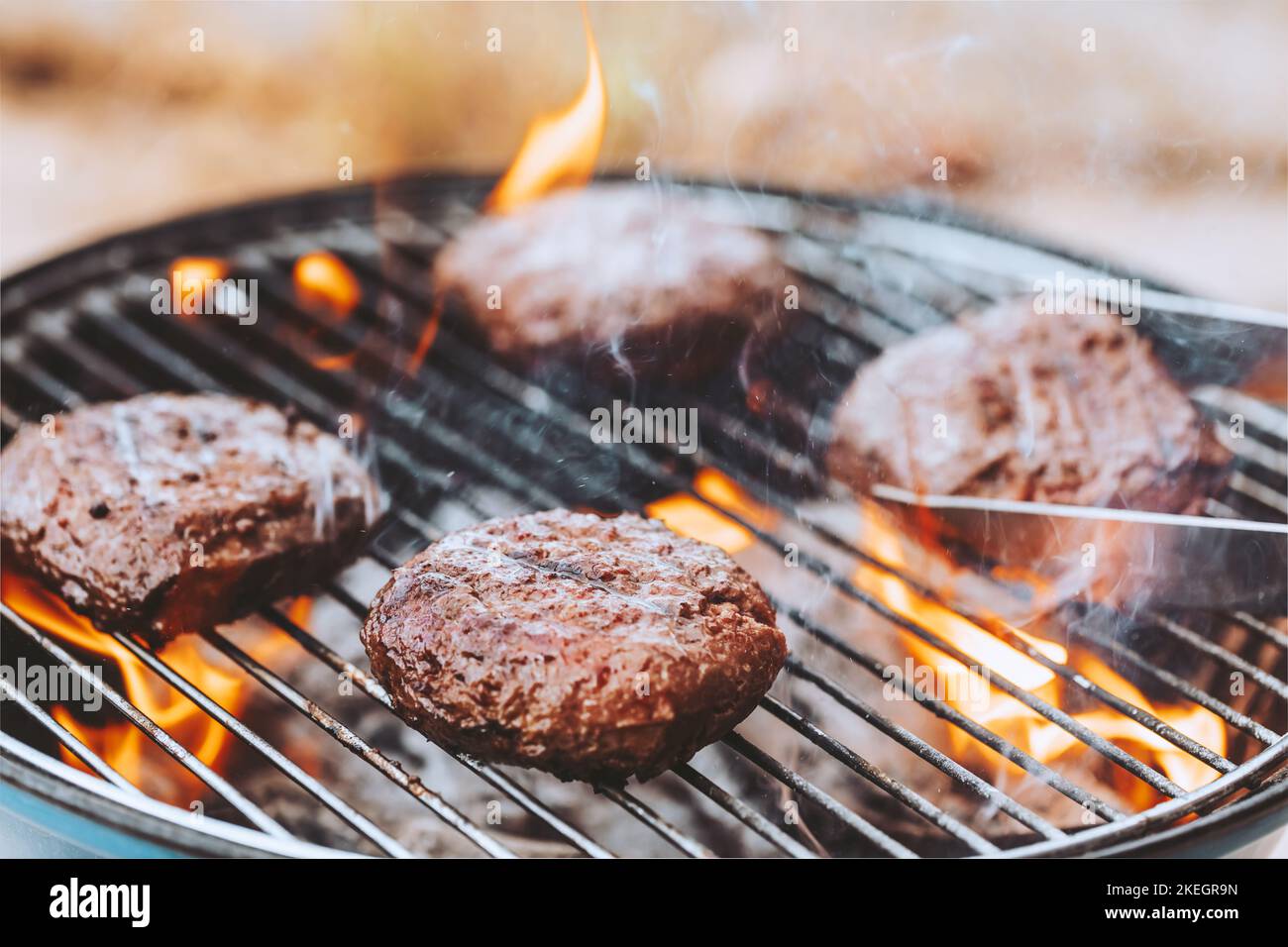 Burgers Patty on BBQ Grill Stock Photo - Alamy