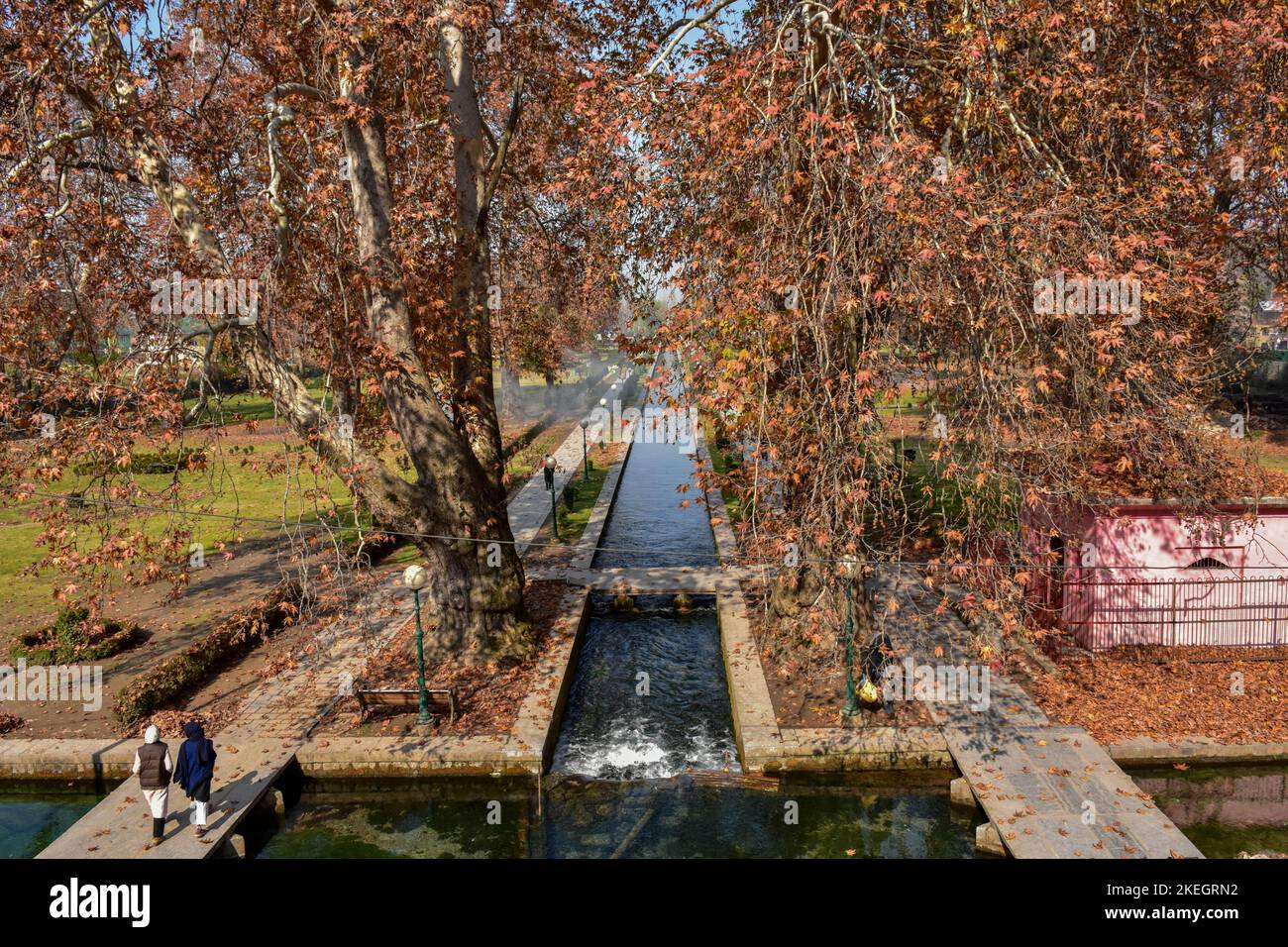 Visitors walk inside the garden on an autumn day in Verinag, about ...
