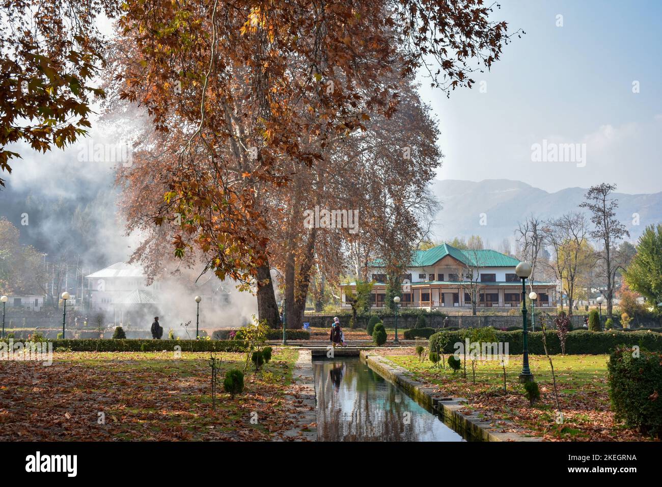 Visitors walk inside the garden on an autumn day in Verinag, about ...