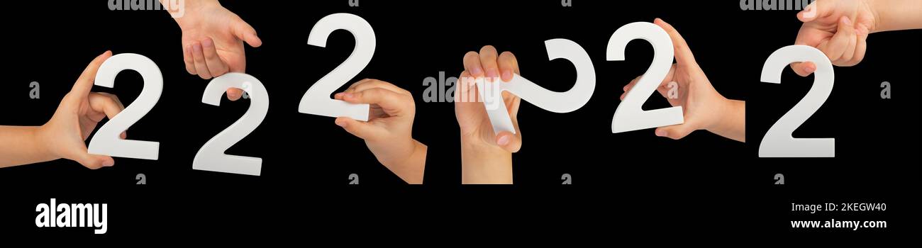 number two in hand isolated on black background. Number two white in a ...