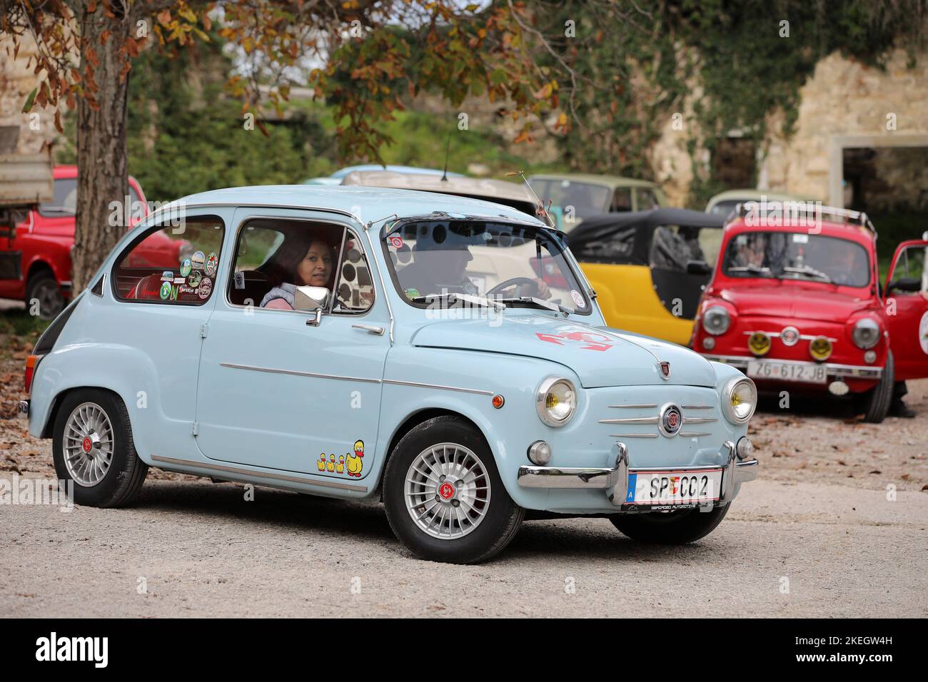 Owners of historic Fiat 600 and Zastava 750 cars gather in the village ...