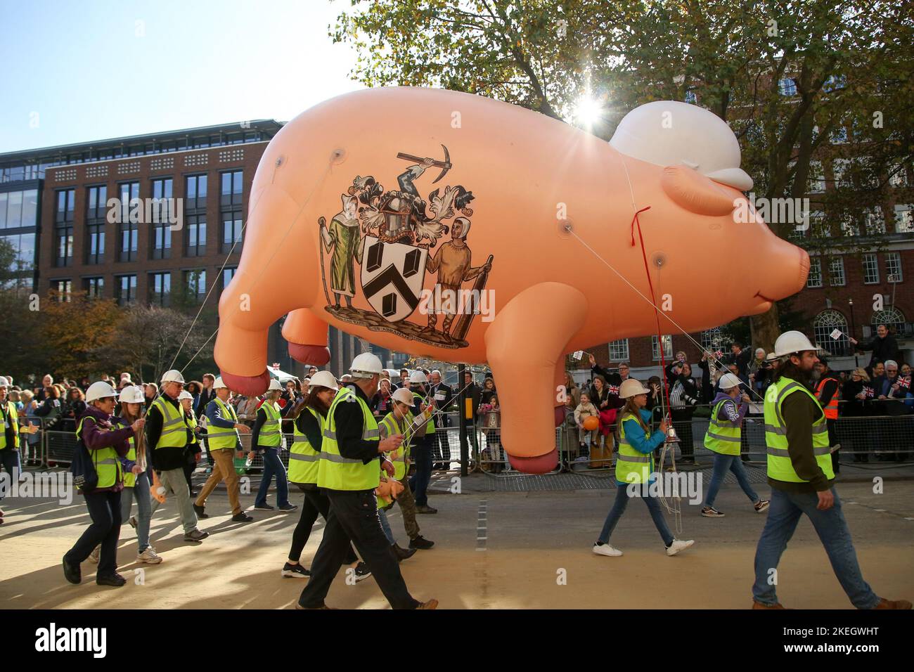 People with an inflatable pig take part during the parade at the Lord ...