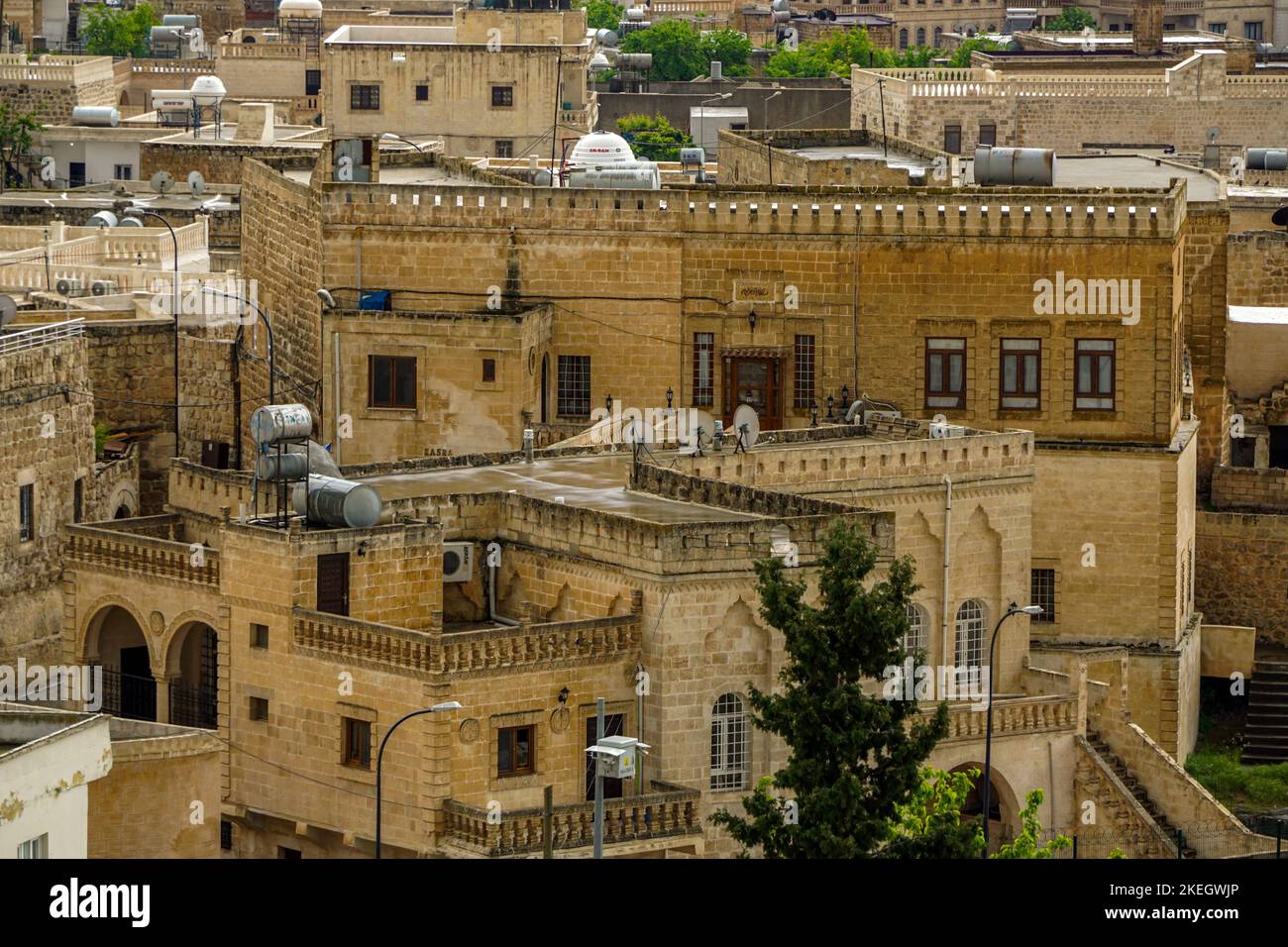 A cityscape of the old town Midyat with its architectural buildings in ...