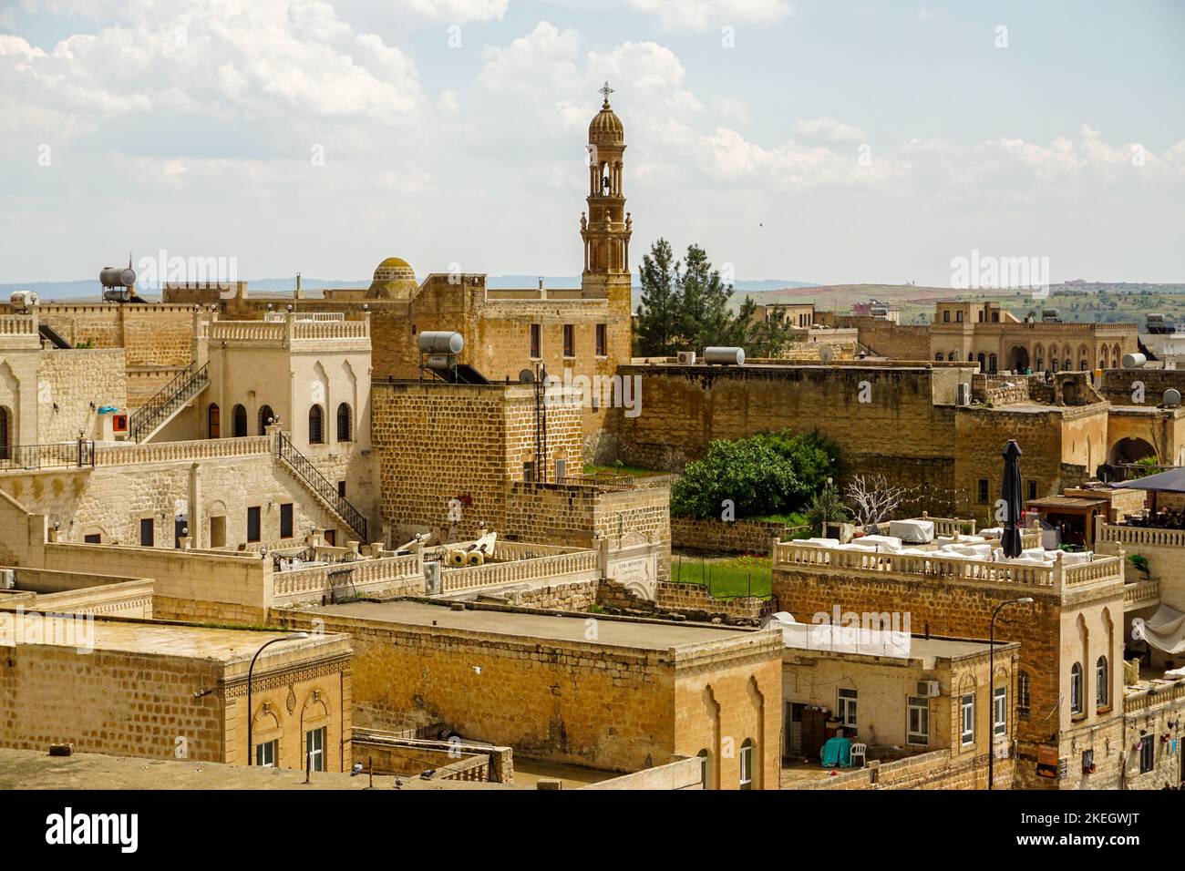 A cityscape of the old town Midyat with its architectural buildings in ...
