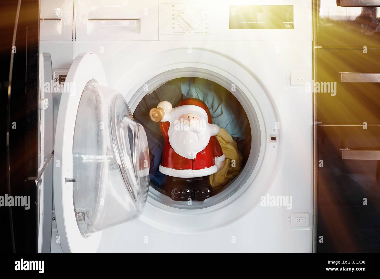 Santa Claus in the washing machine. Christmas Stock Photo - Alamy