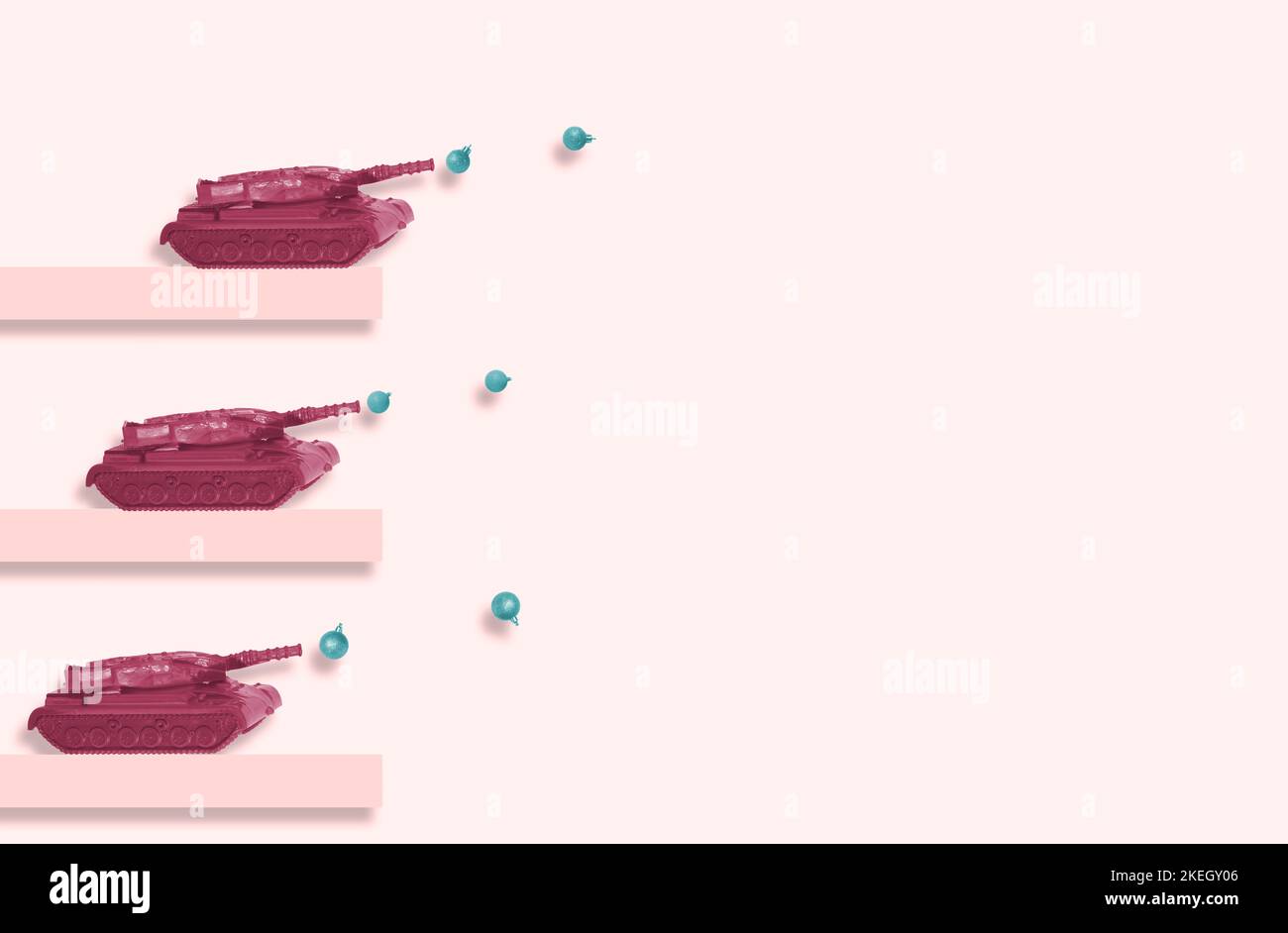 three tanks firing decorations, next to them pink copy space, creative ...