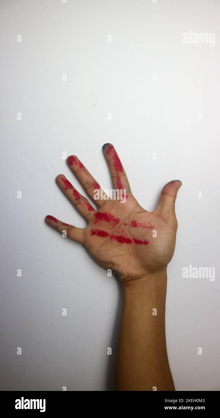 red ink hand on a white background Stock Photo - Alamy