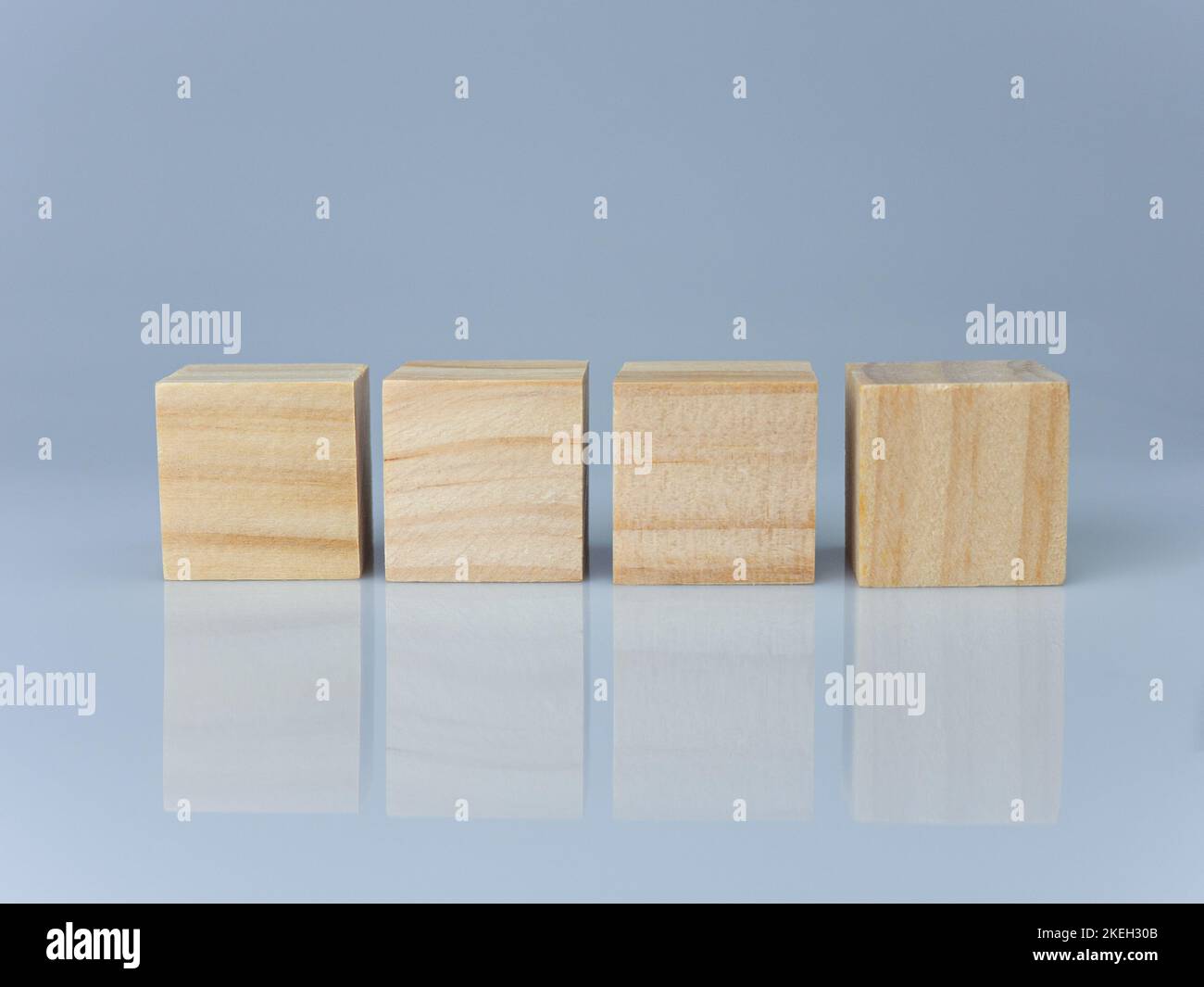 empty wooden blocks lined up on a white background. Business concept ...