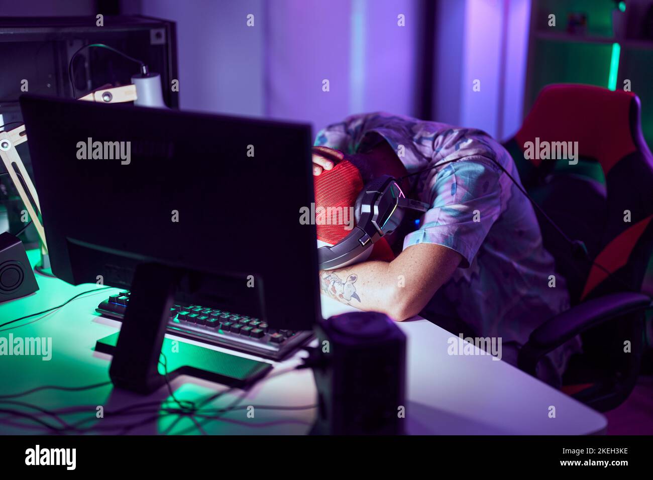 Young redhead man streamer stressed using computer at gaming room Stock ...