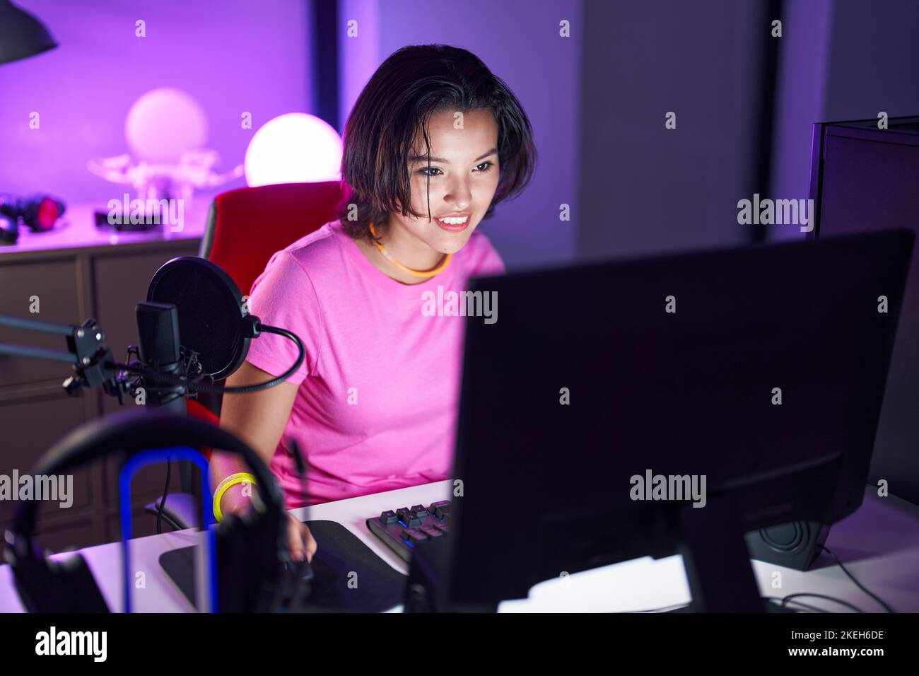 Beautiful asian woman playing computer hi-res stock photography and ...
