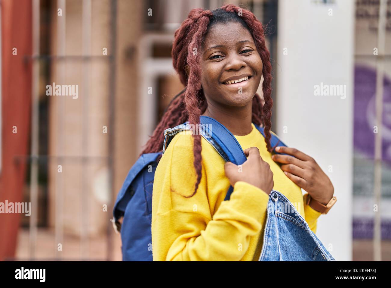 African american woman student smiling confident wearing backpack at ...