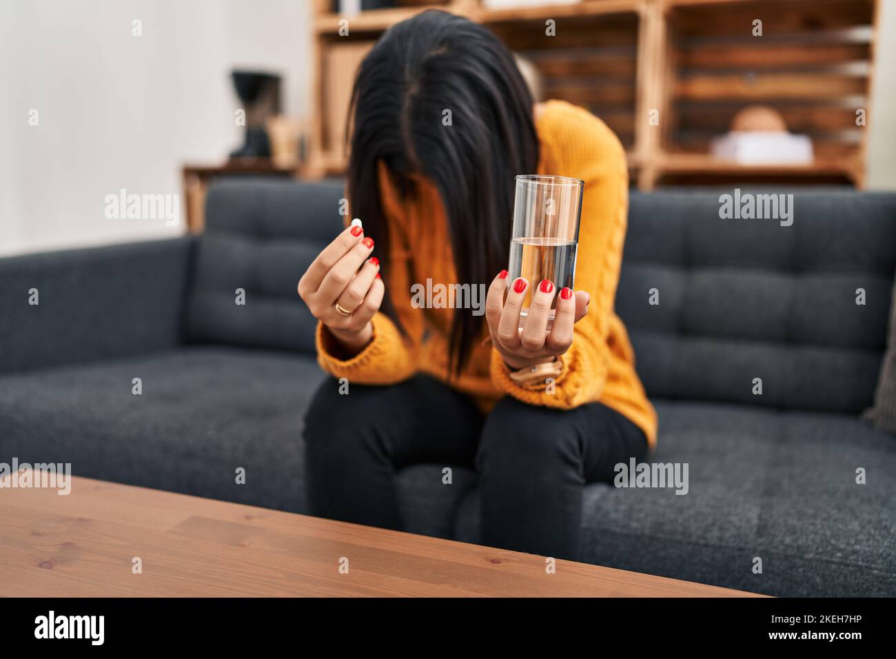 Young latin woman patient holding mental pill treatment at clinic Stock ...