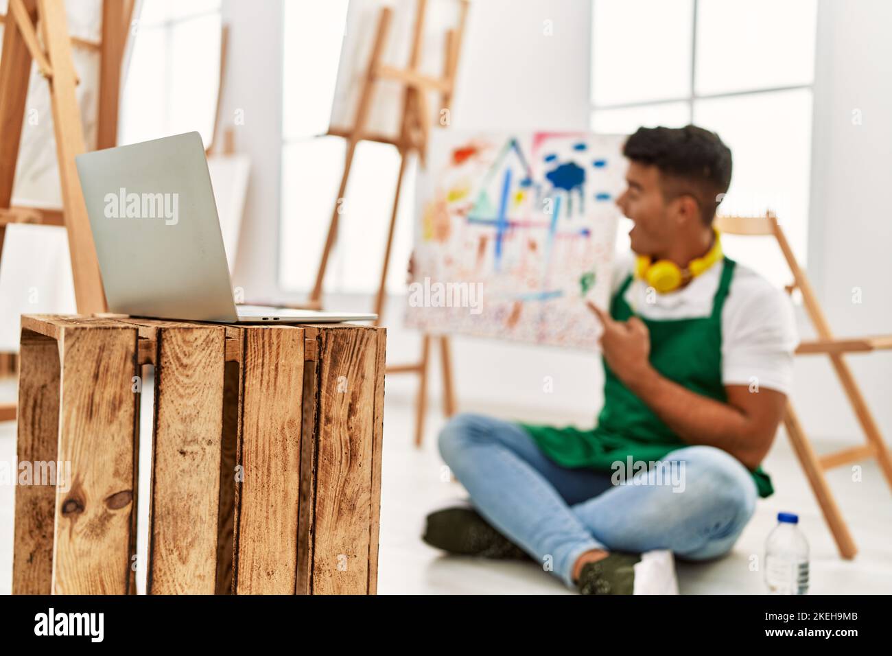 Young hispanic man smiling confident having online draw class at art ...