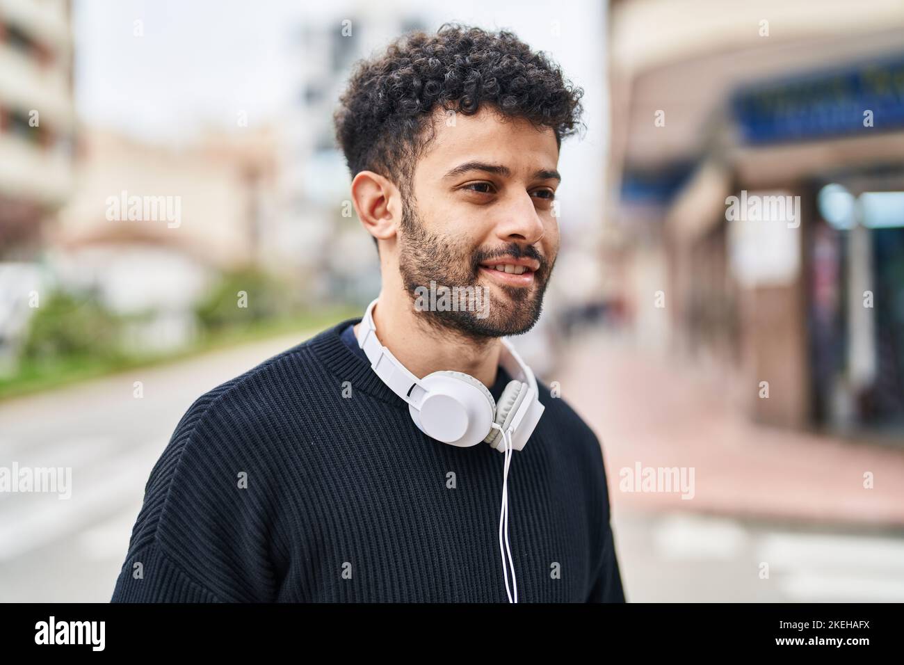 Young arab man smiling confident standing at street Stock Photo - Alamy