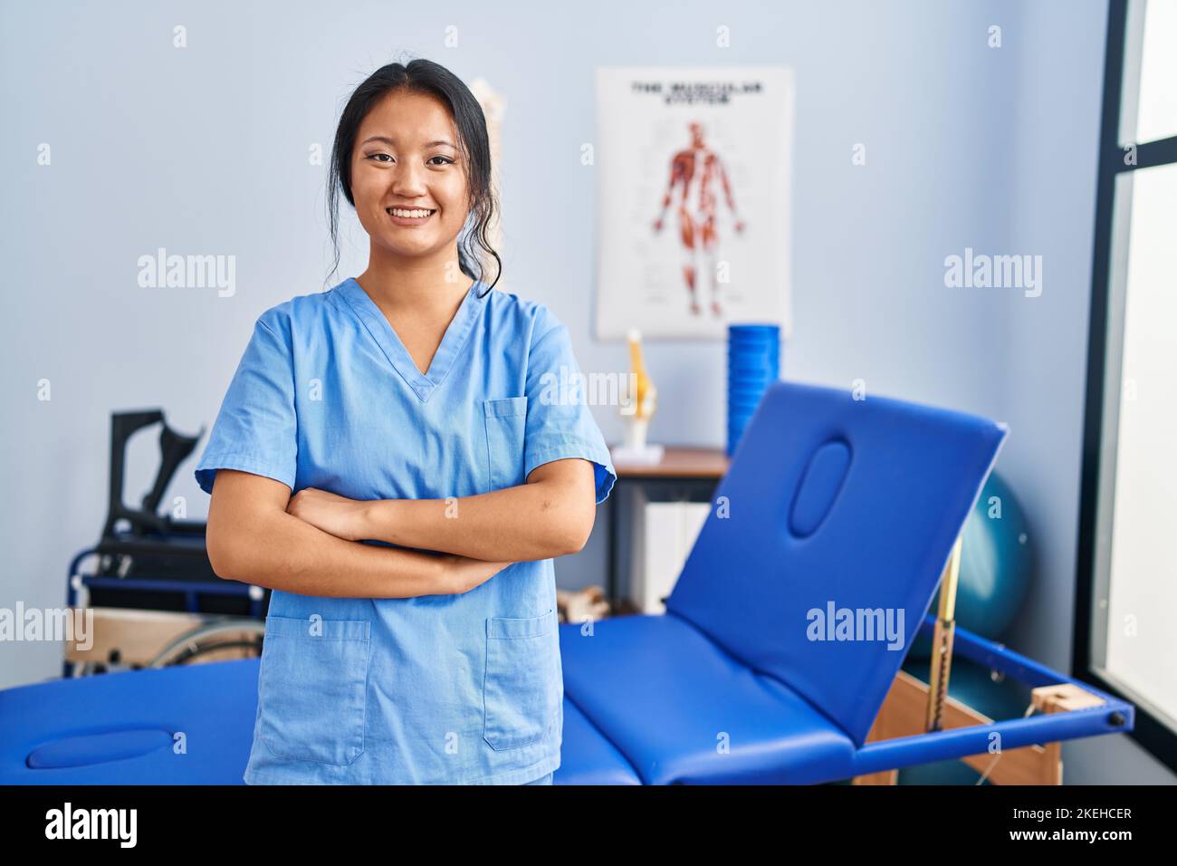 Therapist asian hospital worker standing hi-res stock photography and ...