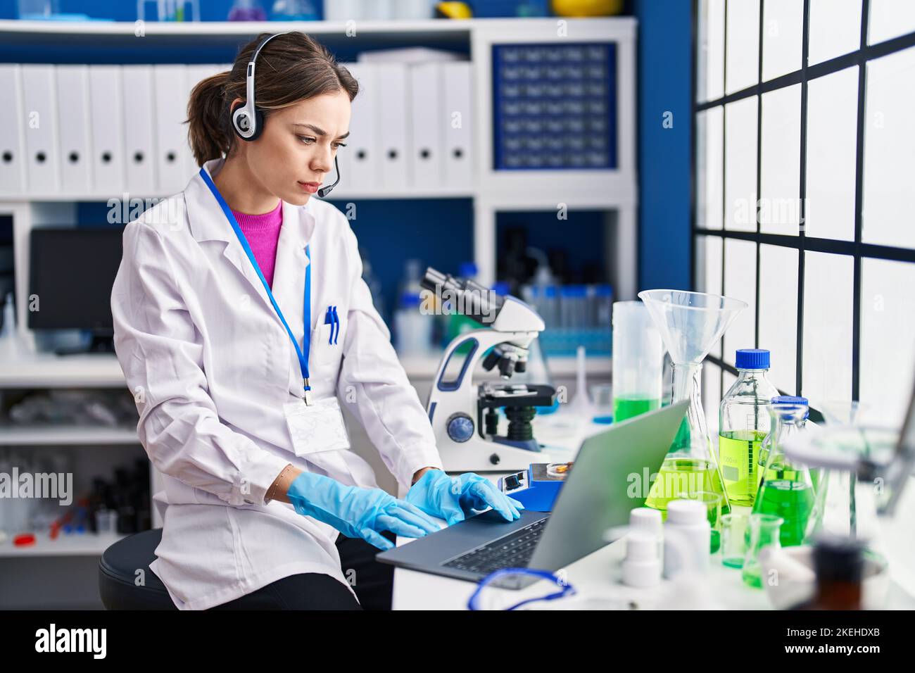 Hispanic woman working at scientist laboratory thinking attitude and ...