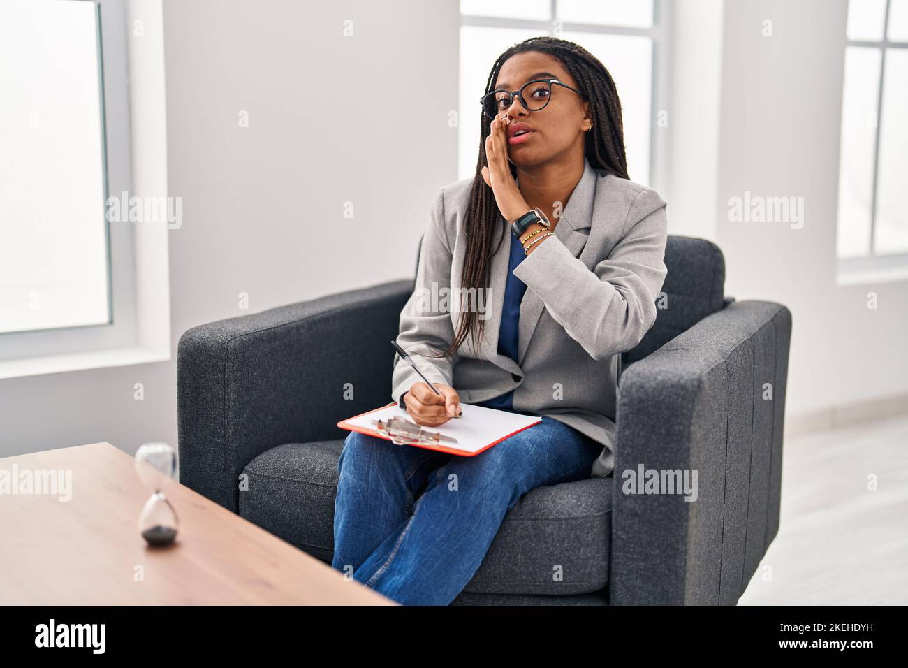 Young african american with braids working at consultation office hand ...