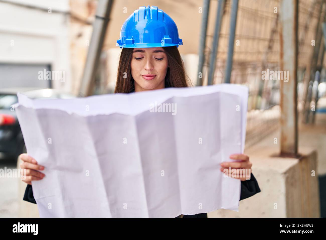 Female construction worker reading blueprints hi-res stock photography ...