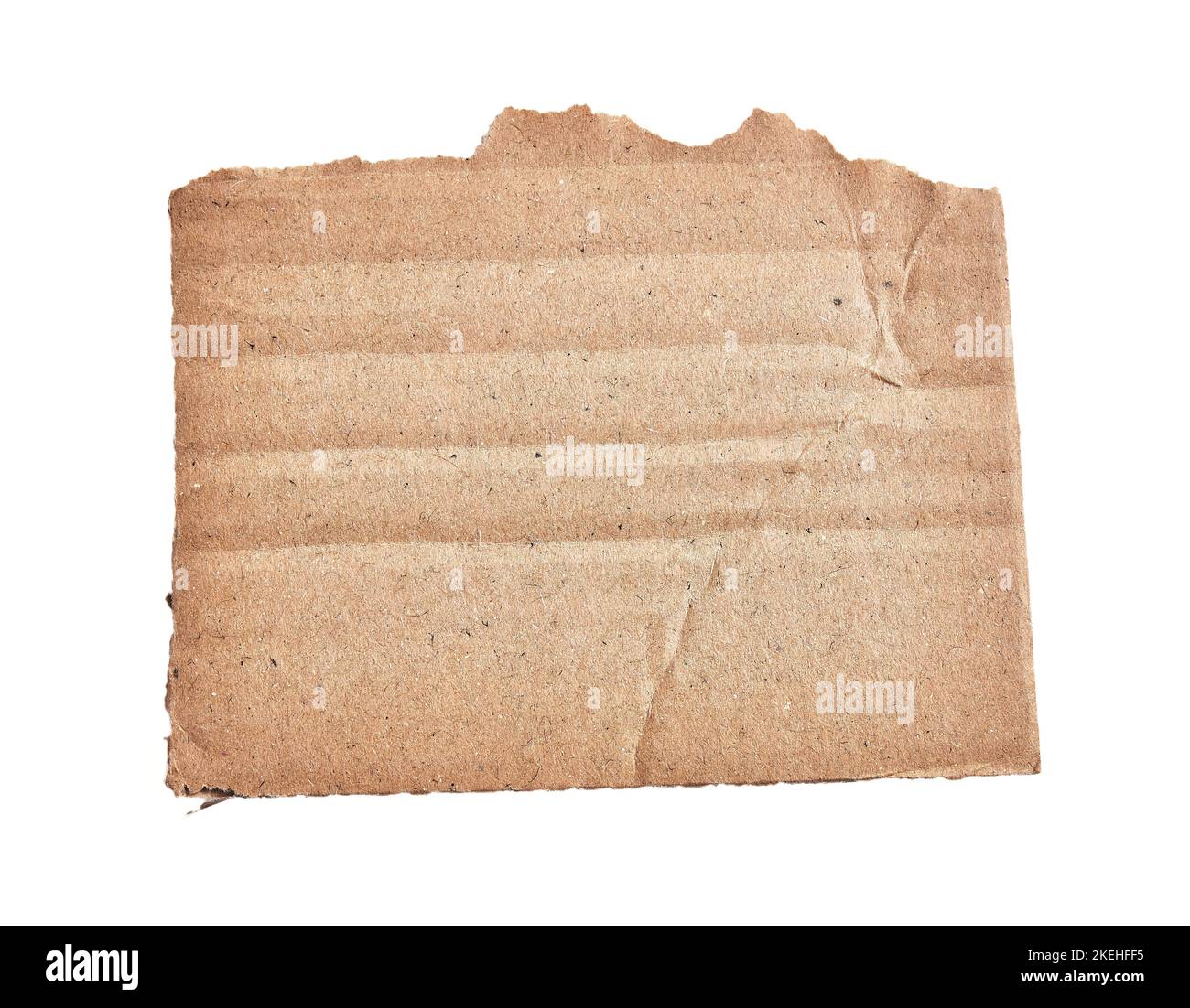One ripped piece of cardboard material over isolated white background ...