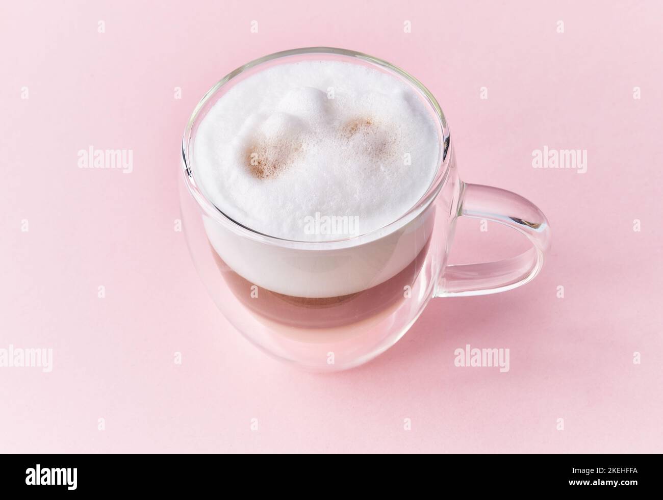 One cup of cappuccino coffee over pink background Stock Photo - Alamy