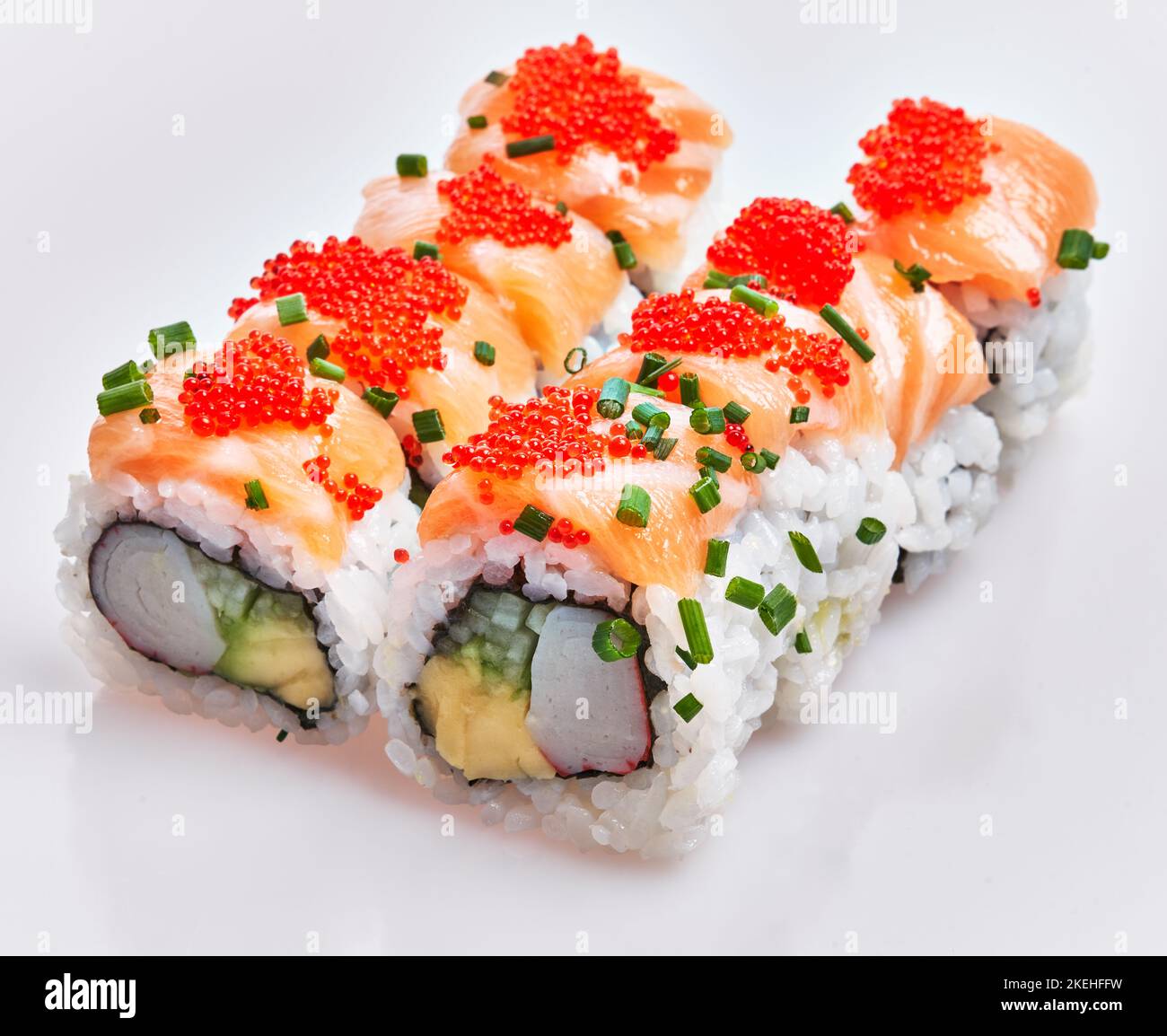 Group of delicious salmon uramaki rolls over isolated white background ...
