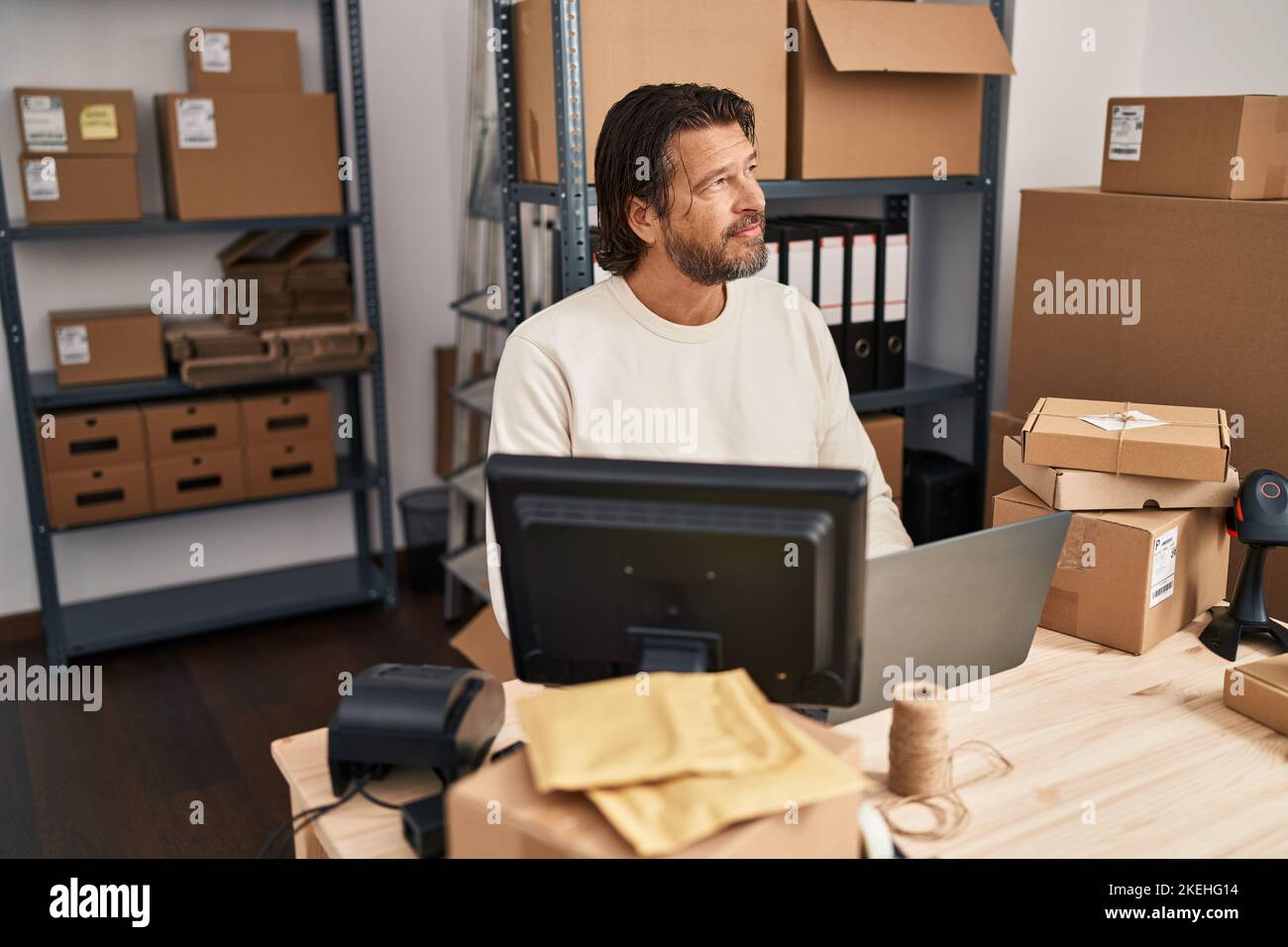 Middle age man ecommerce business worker using laptop at office Stock ...