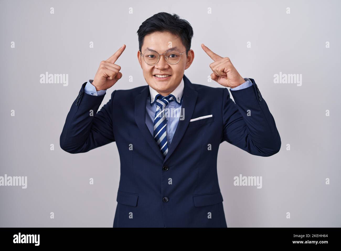 Positive korean male pointing finger hi-res stock photography and ...