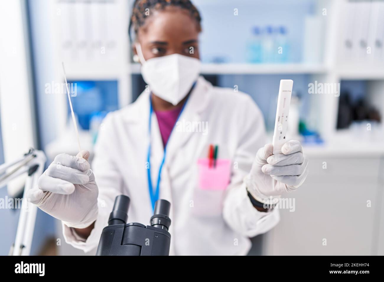 African american woman wearing scientist uniform and medical mask ...
