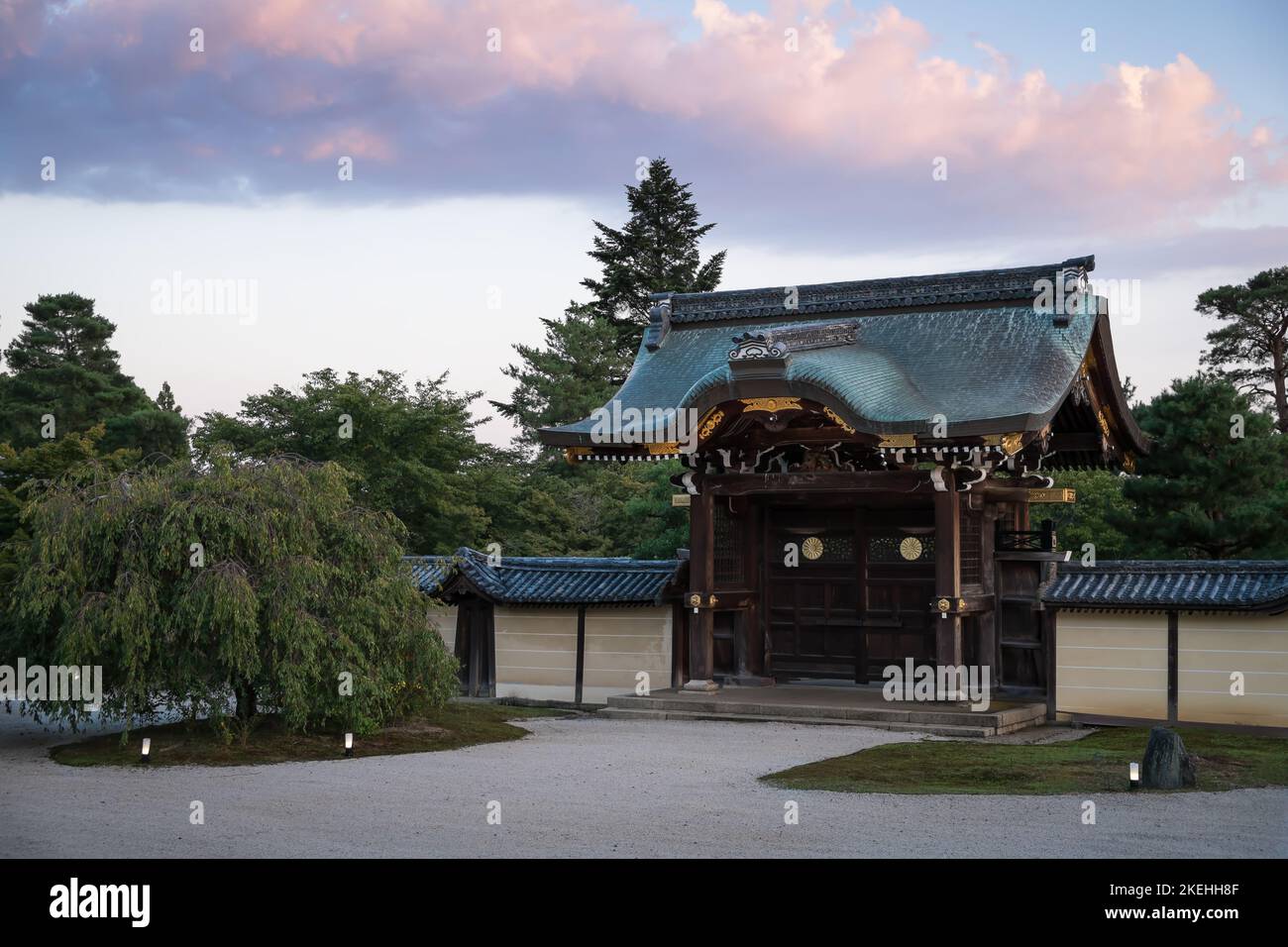 Kyoto Daikakuji buddhist temple gate on a autumn pink sunset day with ...