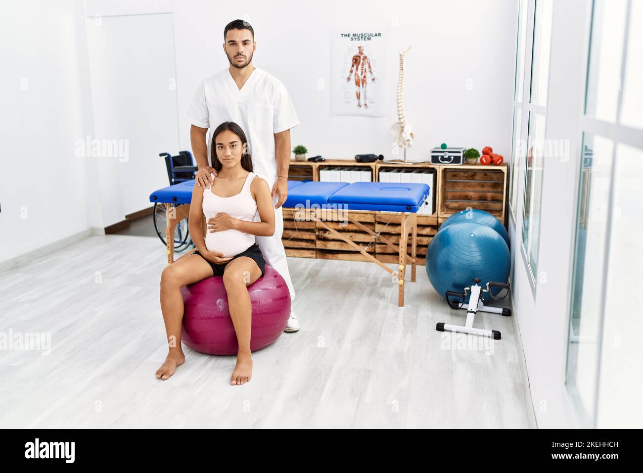 Young asian woman getting pregnancy class at physiotherapist clinic ...