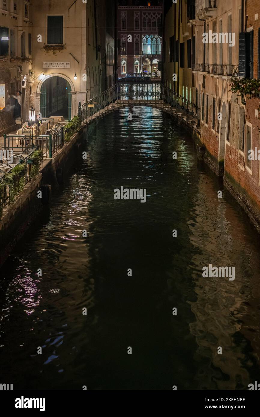 Narrow Venetian canal at night Stock Photo - Alamy