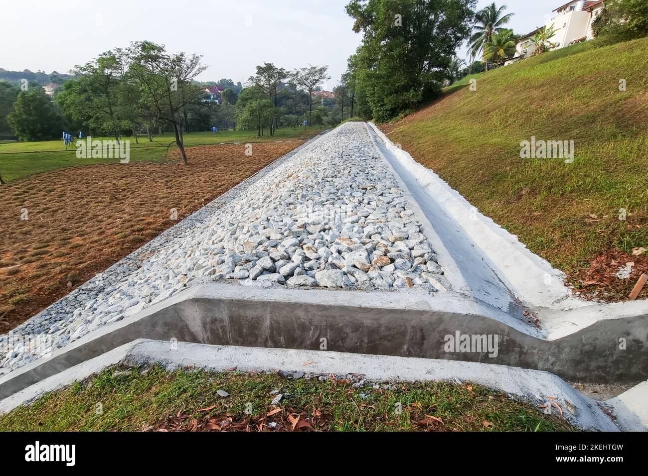 Completed slope retention construction design with rocks and mesh to ...