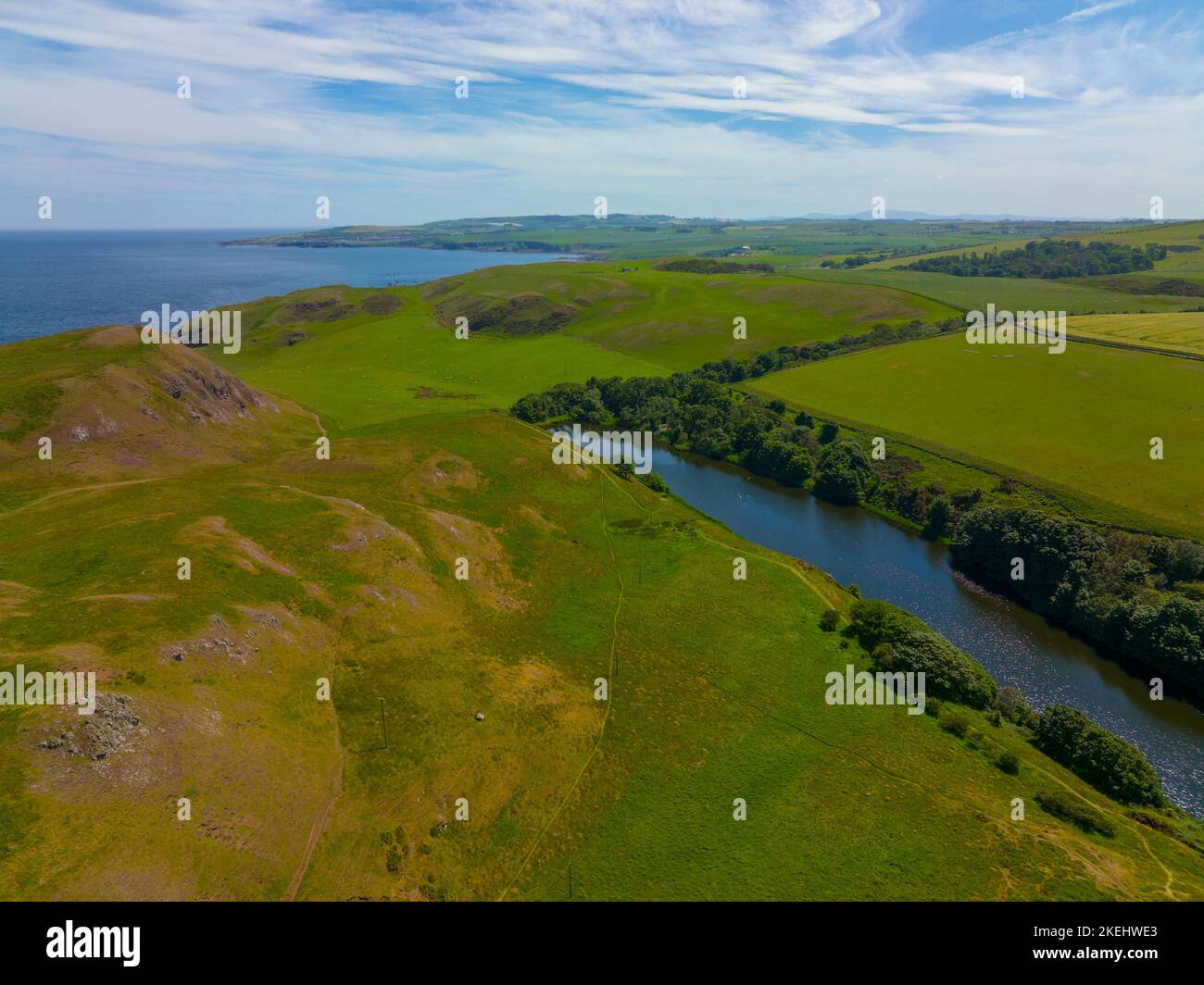 St. Abbs Head coastal cliffs and Mire Loch aerial view in summer near ...