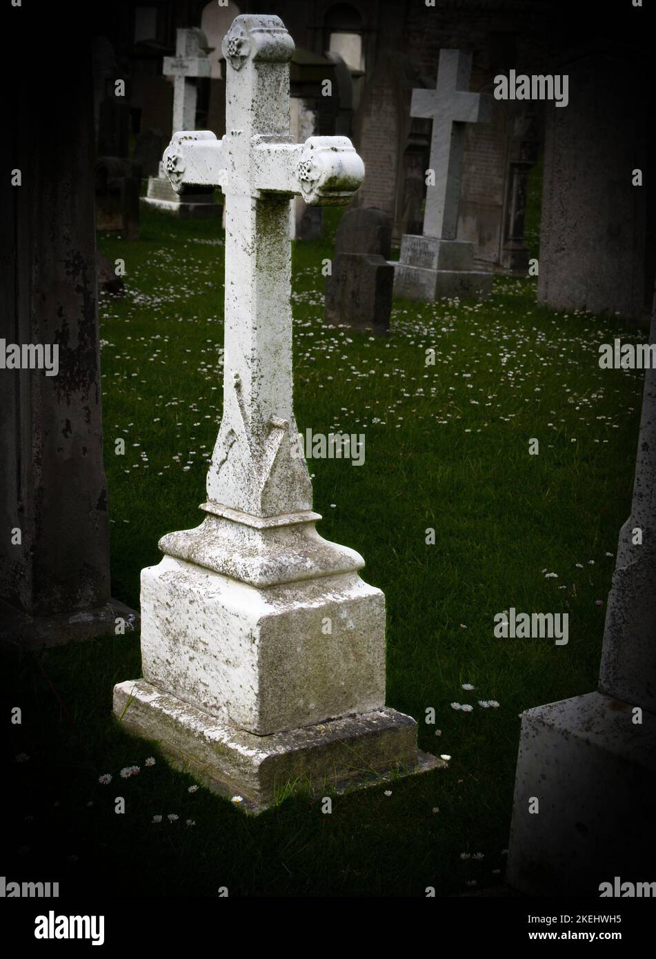 Graveyard with old white cross tombstones in spooky effect Stock Photo ...