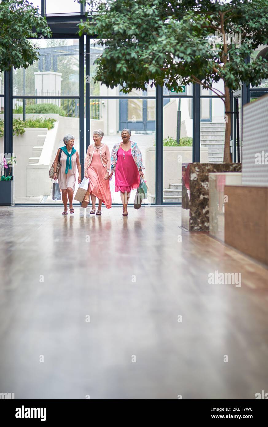 Meeting at the mall. Full length shot of a three senior women out on a ...