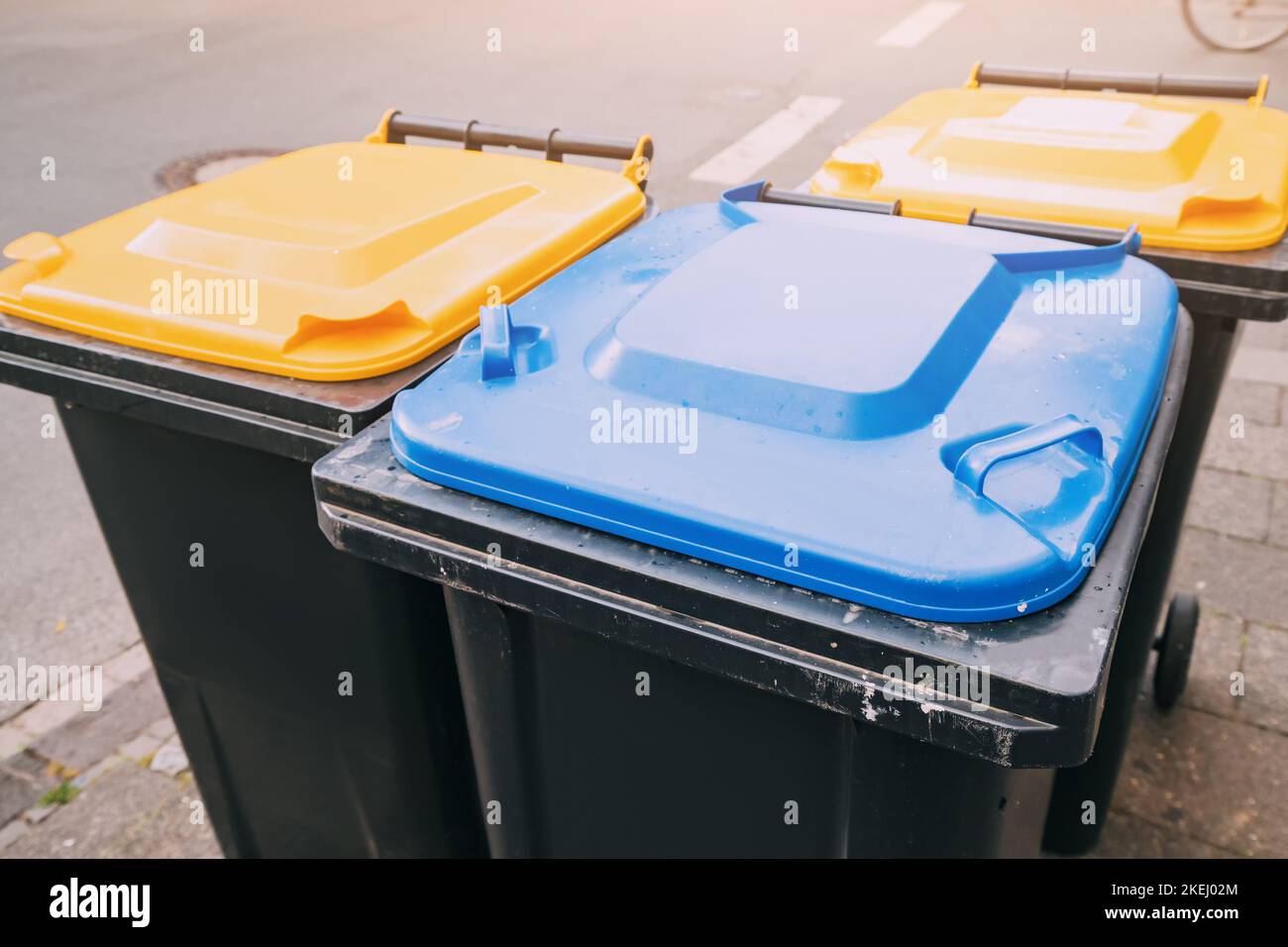 Group of new and clean garbage bins at city street. Trash and rubbish ...