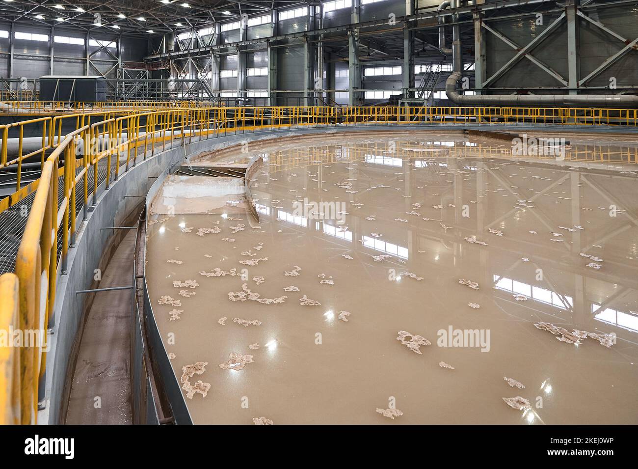 Brown liquid material in contemporary gravity thickener Stock Photo - Alamy