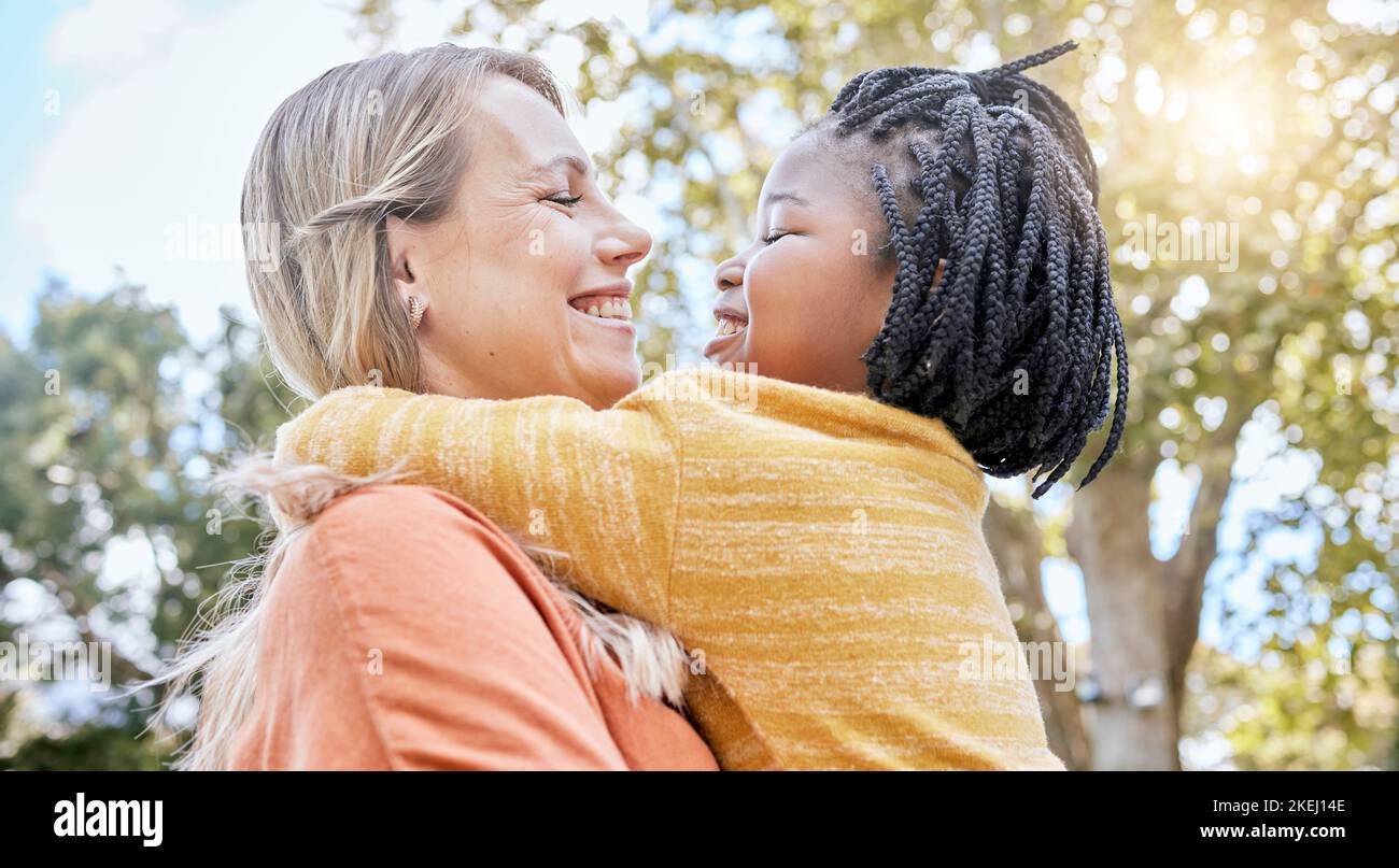 Mother and child hug in park with love and relationship outdoor and ...