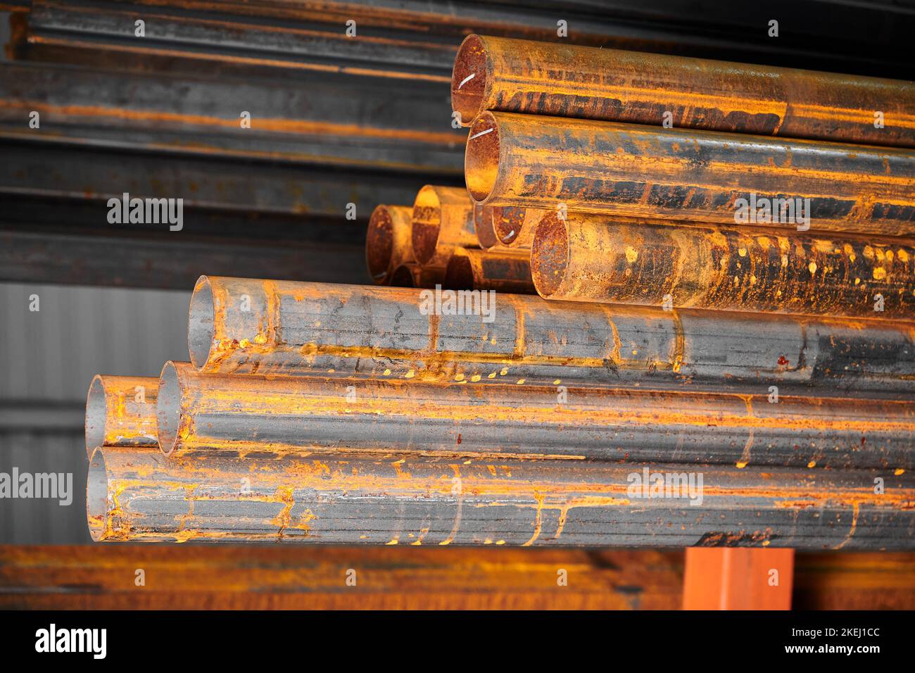 Bundle of rusty metal tubes in industrial complex storehouse Stock ...