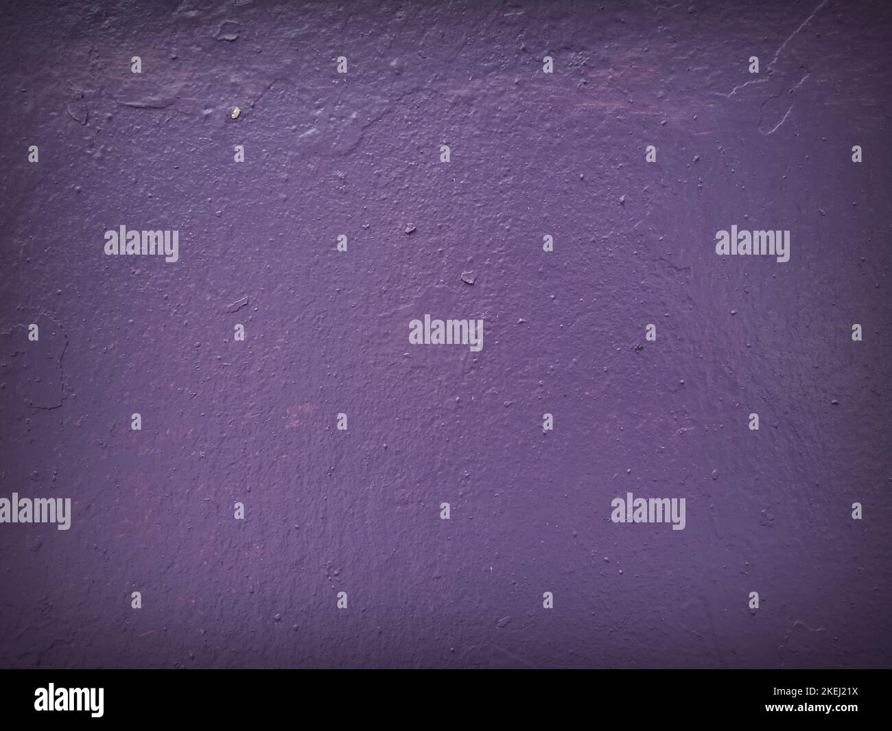 Purple cement wall has cracks at home Stock Photo - Alamy