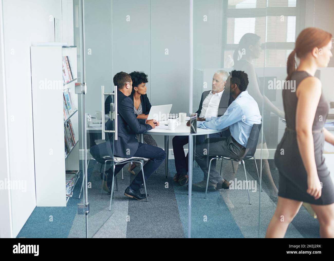 The companys decision makers. a group of businesspeople having a ...